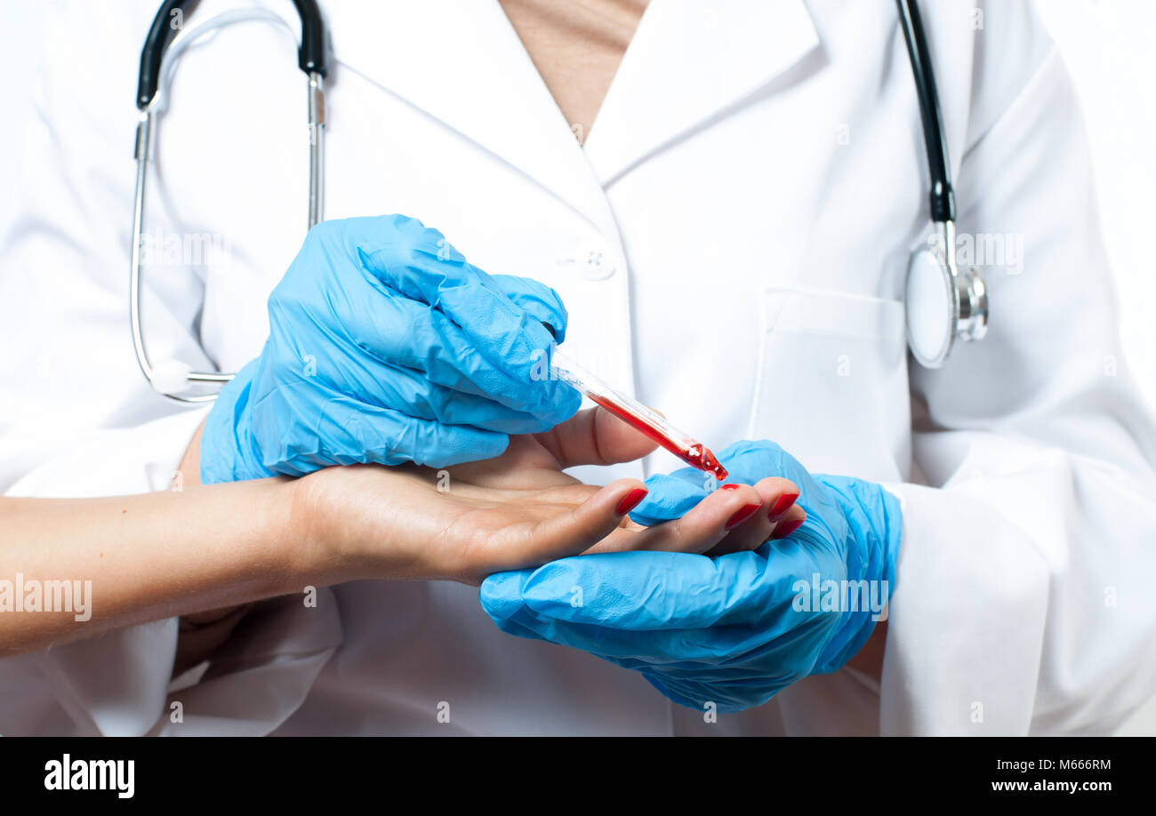 Finger blood test. Doctor and patient Stock Photo - Alamy