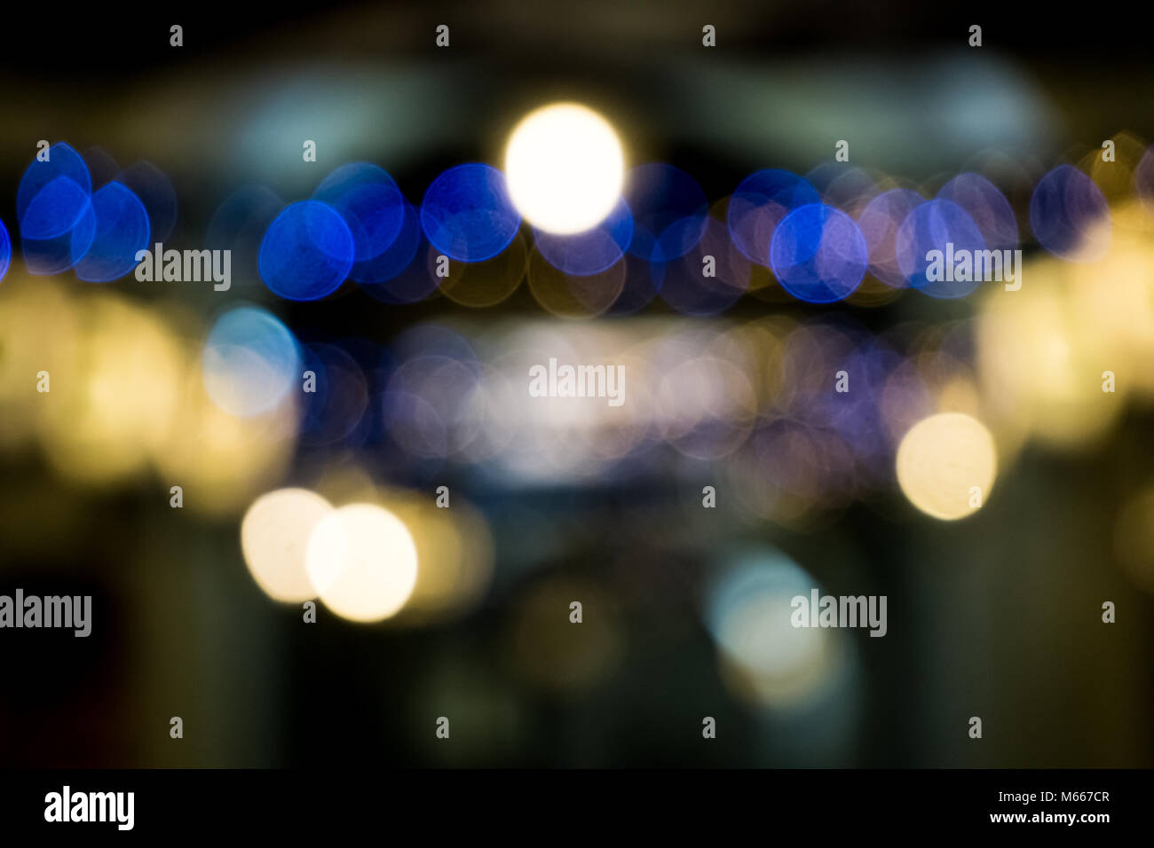Blue glitter vintage lights background. defocused Stock Photo - Alamy