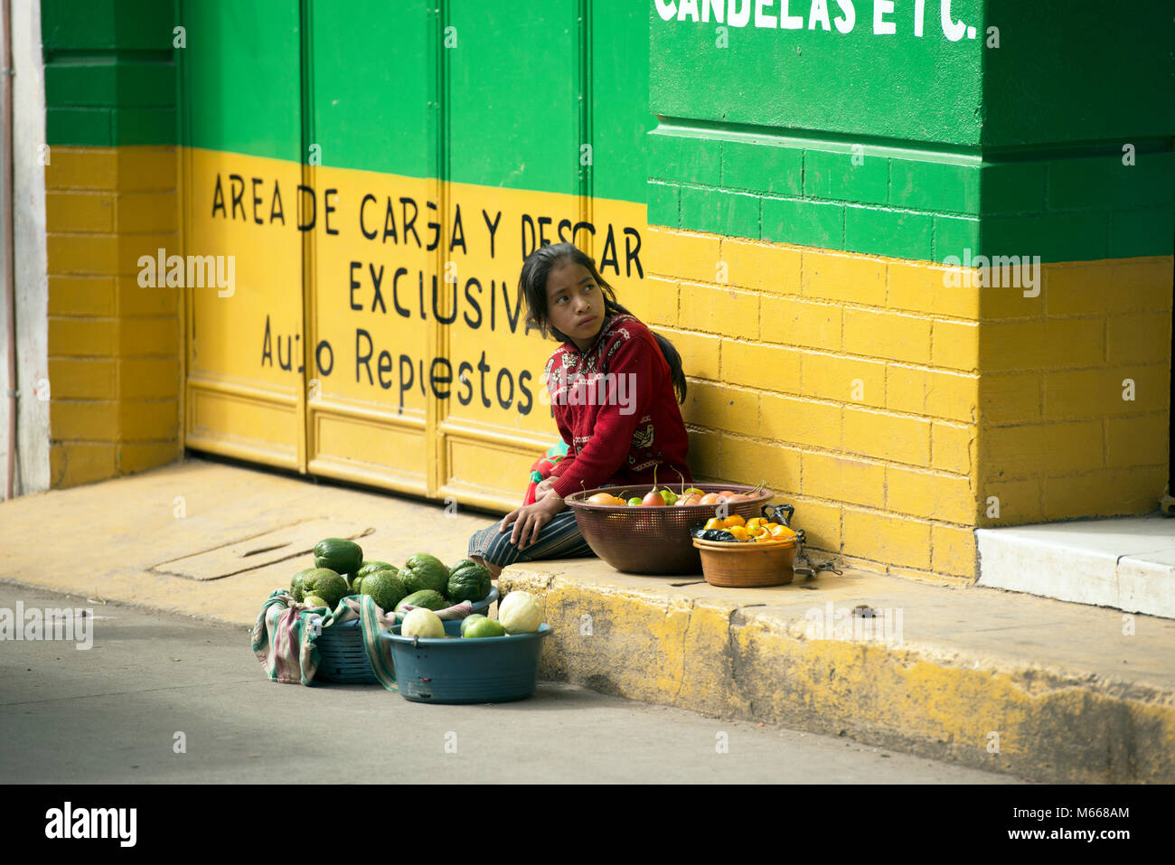 A young, indigenous K'iche' (Quiché) Maya girl in traditional dress ...