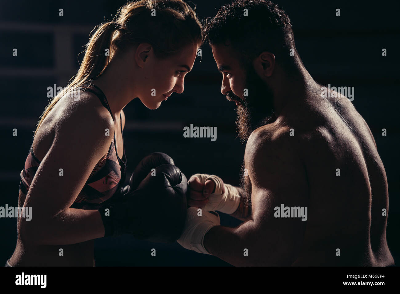 boxers with fighting stance against black background Stock Photo - Alamy