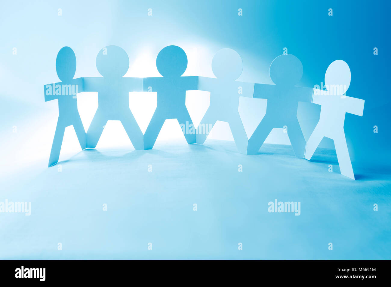 Team of paper chain people Stock Photo - Alamy