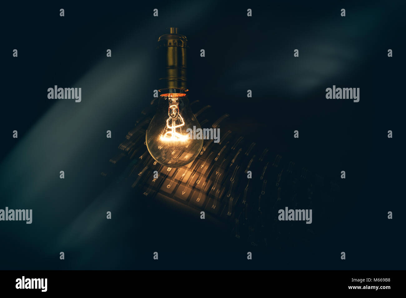 Light bulb and computer keyboard, concept of wisdom Stock Photo - Alamy