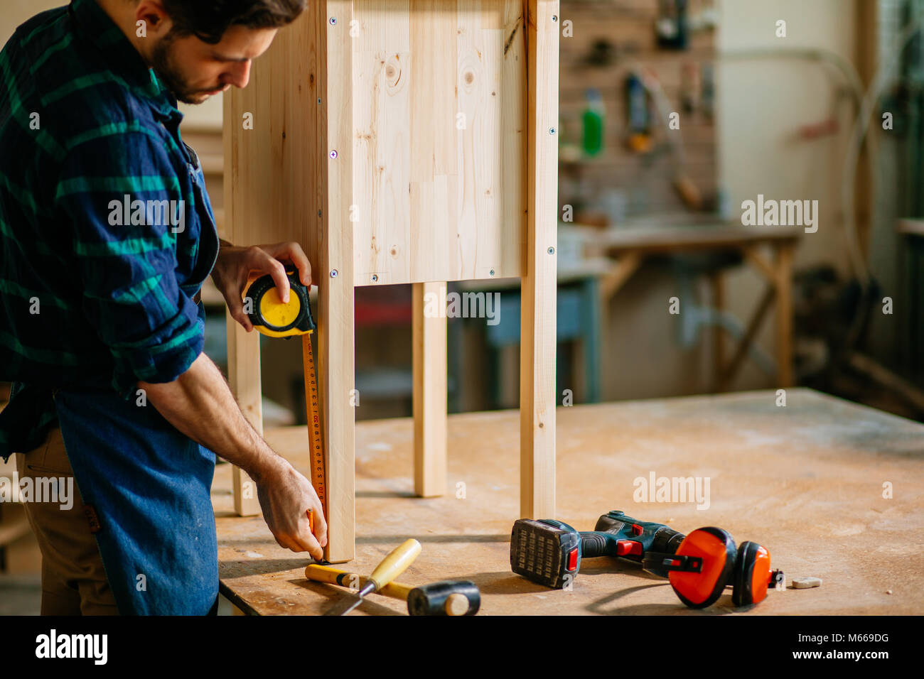 carpenter working in his woodwork or workshop Stock Photo - Alamy