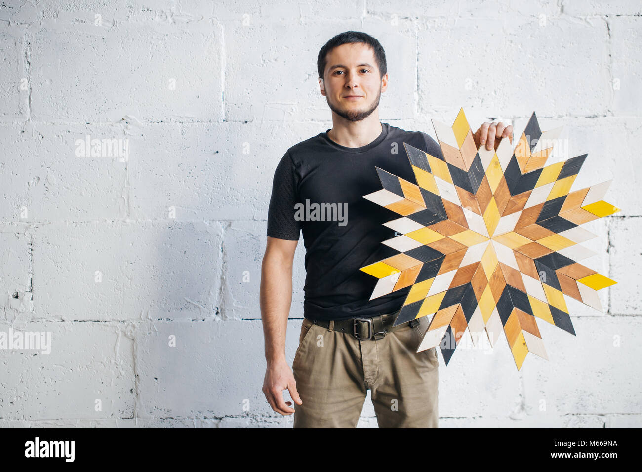carpenter standing with a wood product and looking at camera Stock ...
