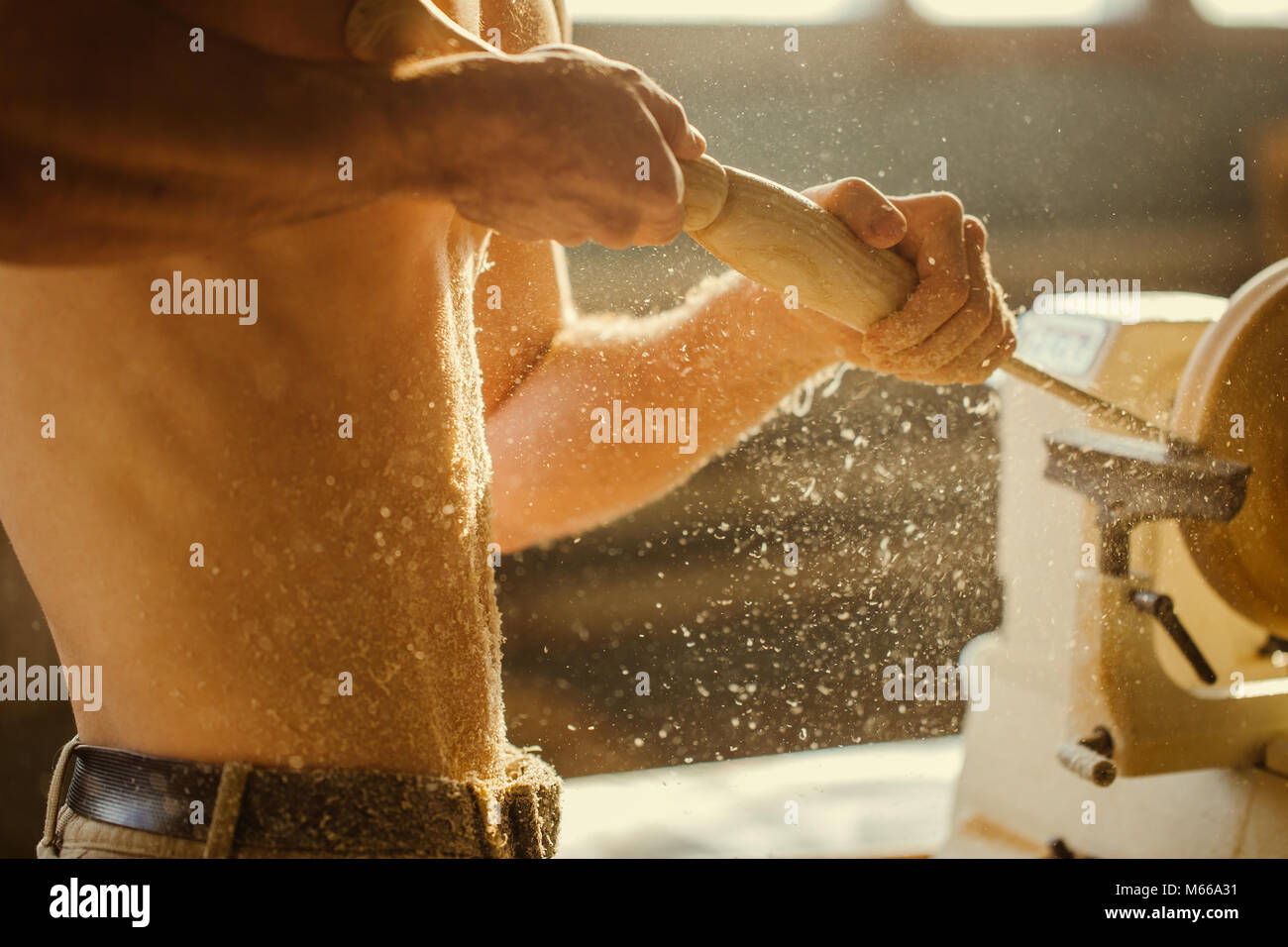 Wood lathe. Carpenter lathing wood Stock Photo - Alamy