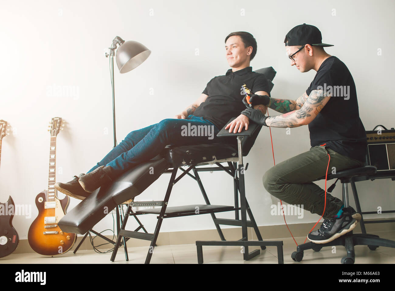 the process of creating a tattoo Stock Photo - Alamy