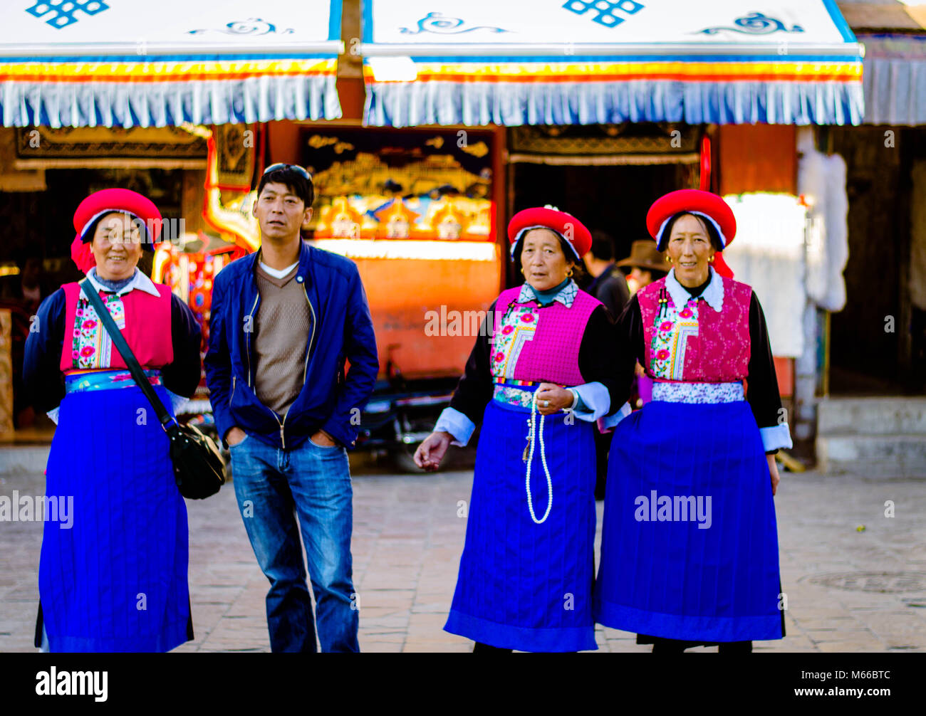 Tibetans wearing colorful traditional clothes in Lhasa Stock Photo - Alamy
