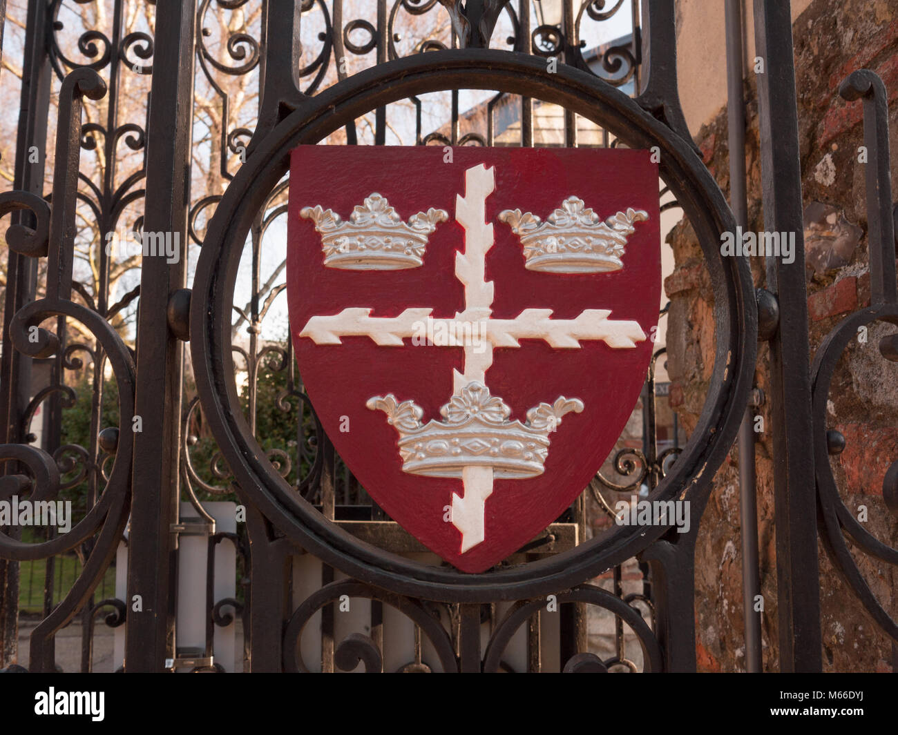 colchester shield sign emblem on gates red and black town park; essex ...