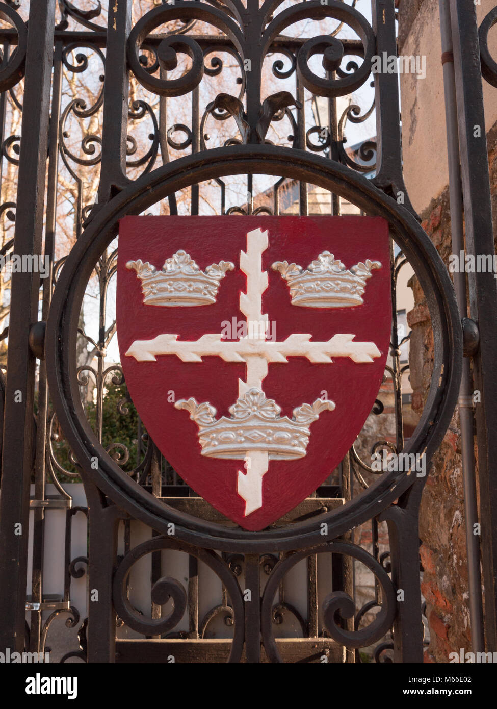 colchester shield sign emblem on gates red and black town park; essex ...