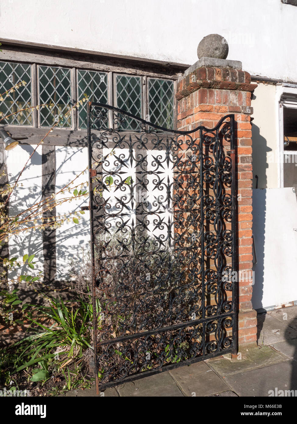 close up of old black iron gate open side retro style; essex; england ...