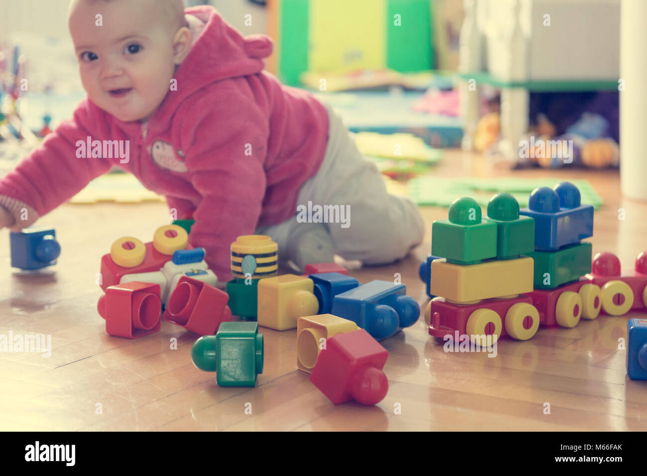 Infant girl playing bricks hi-res stock photography and images - Alamy