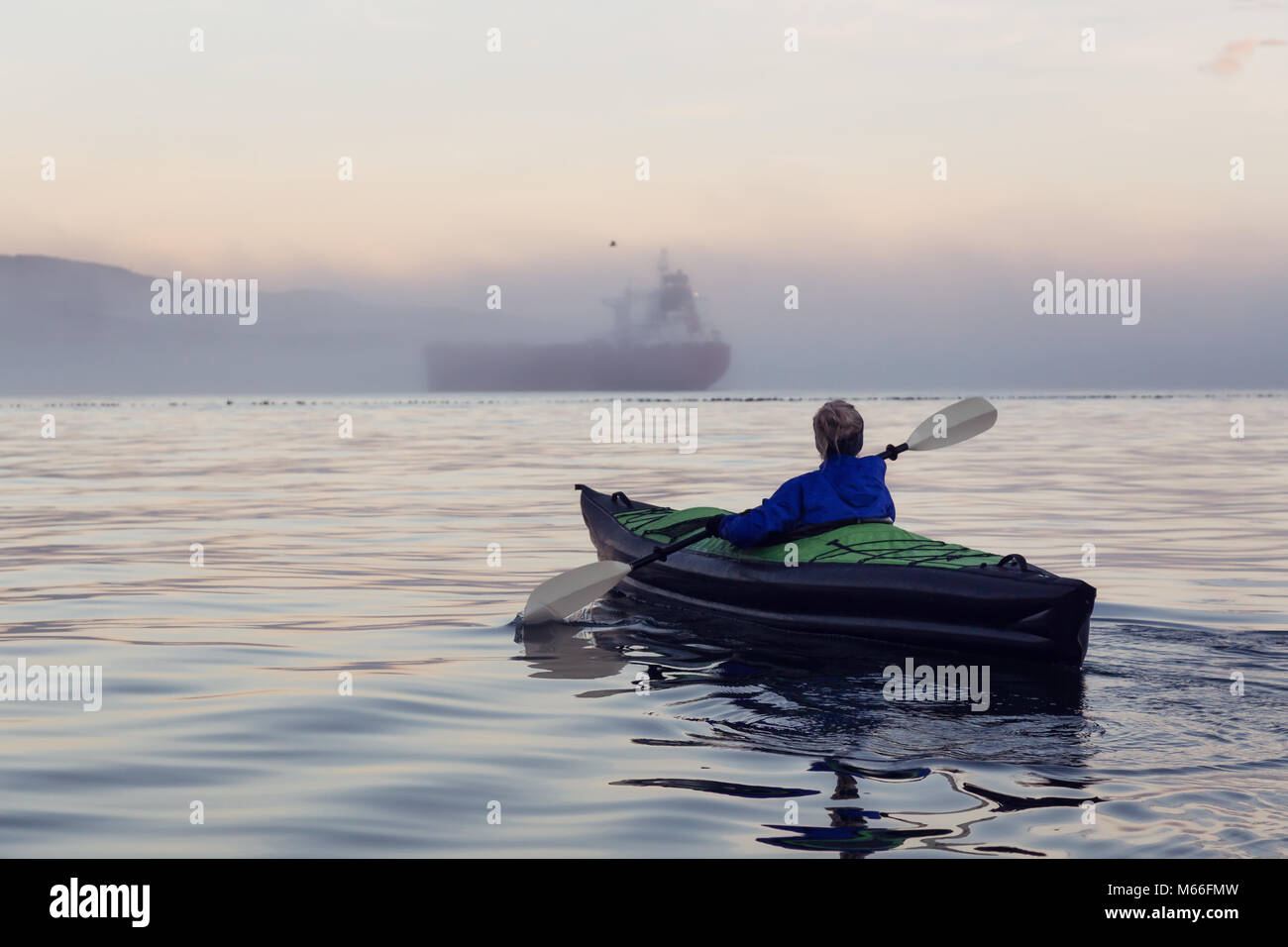 Adventure girl is kayaking on an inflatable kayak in Horseshoe Bay with ...