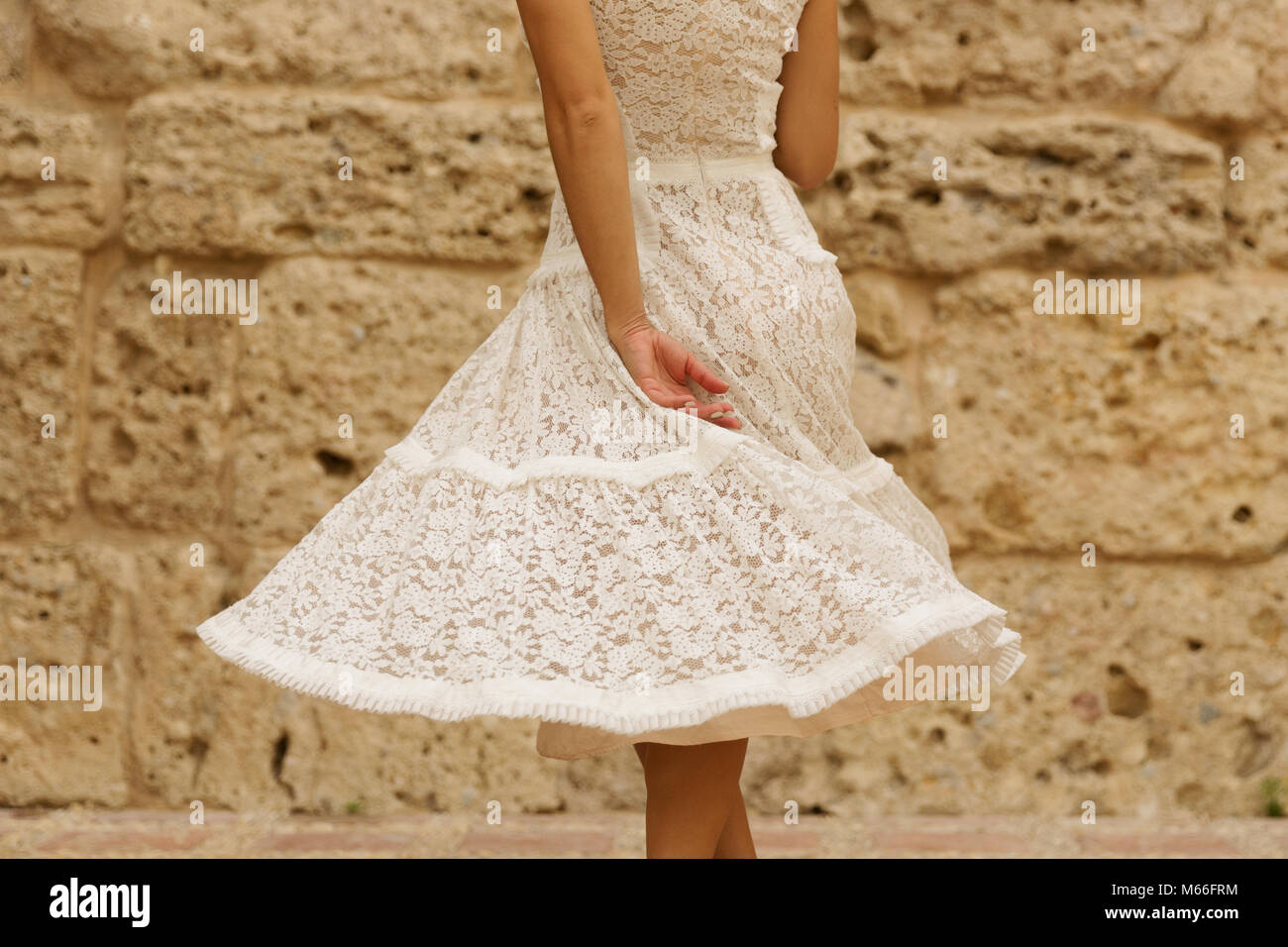 Woman in a lace dress spinning around Stock Photo - Alamy