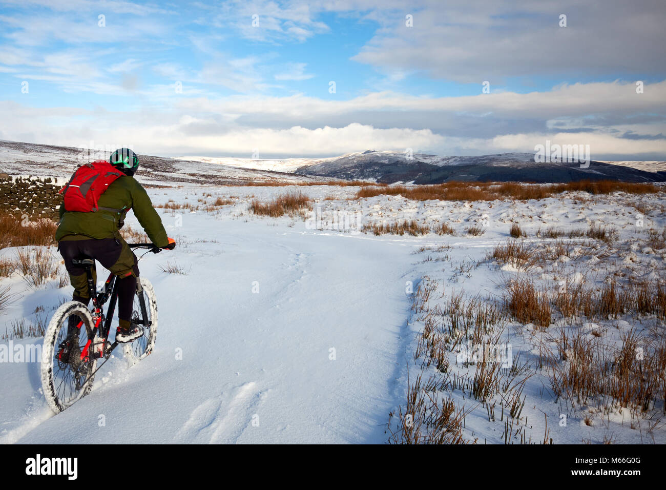 Biking through snow hi-res stock photography and images - Alamy