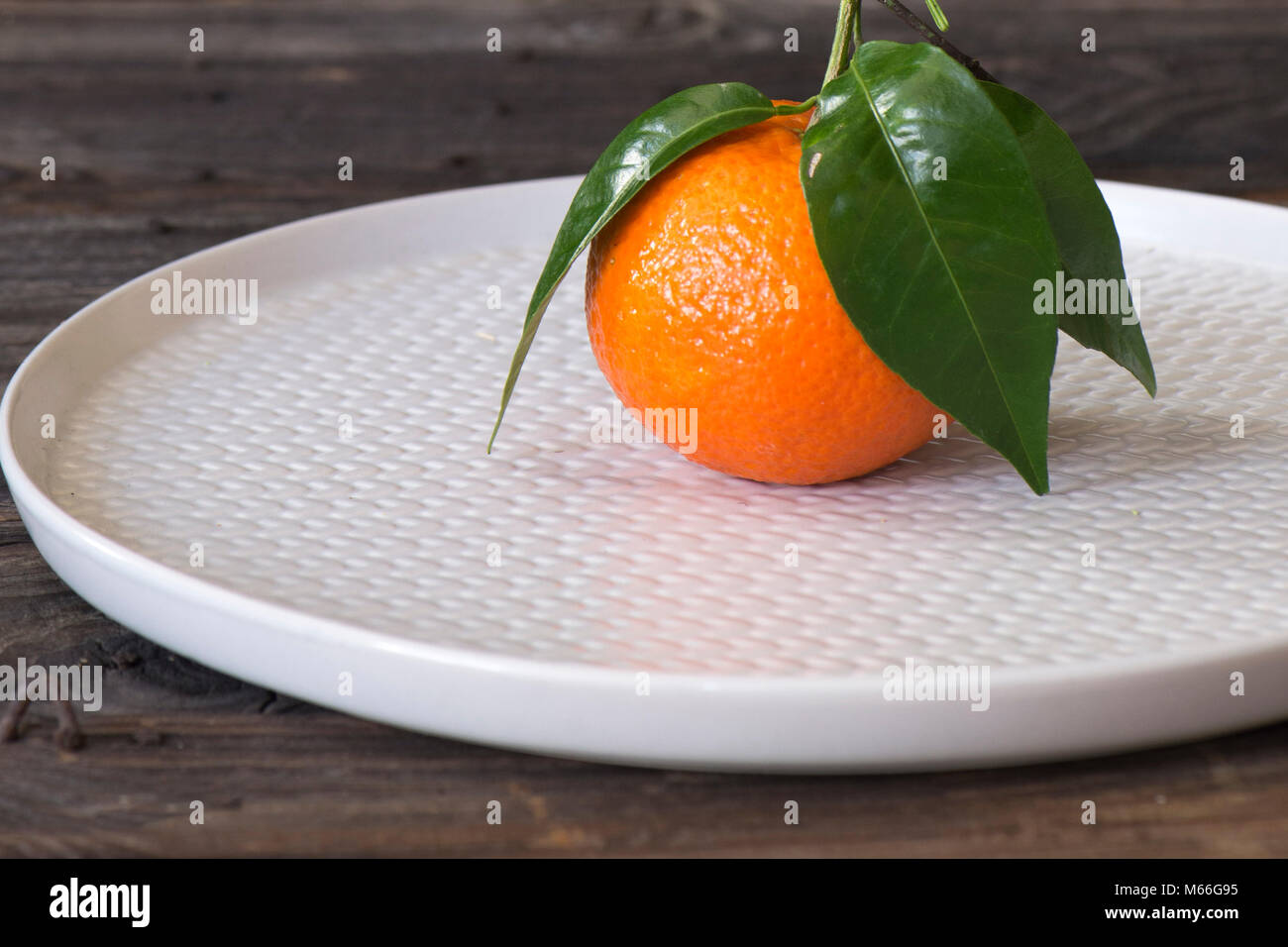 Mandarin on a plate Stock Photo - Alamy