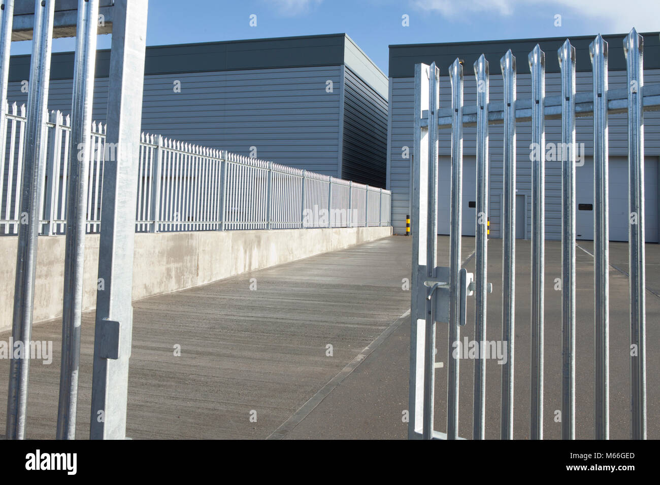New warehousing depot metal cladding and loading bay's blue sky and ...