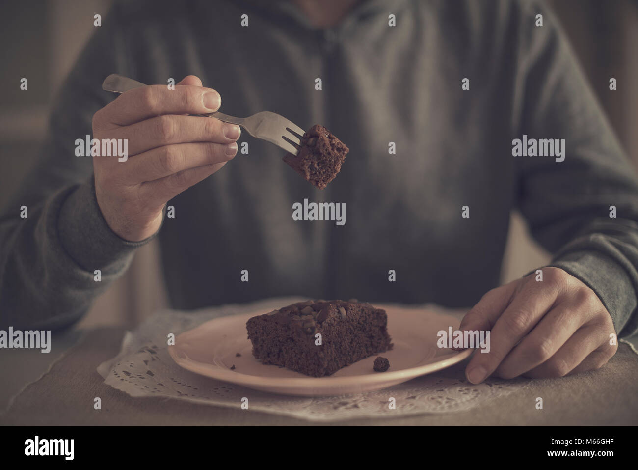 Man eating chocolate cake Stock Photo - Alamy