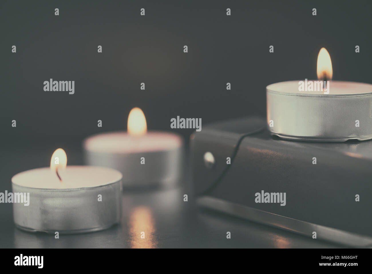 Three tealight candles Stock Photo - Alamy