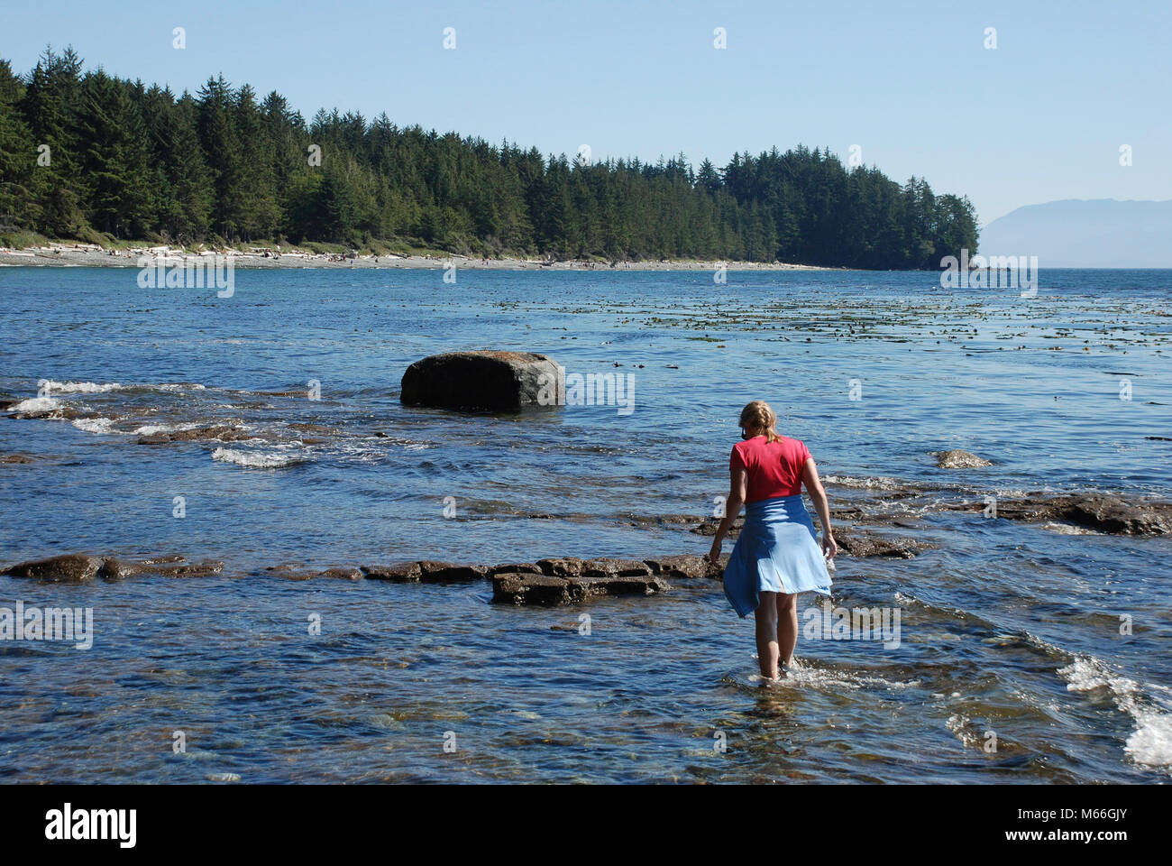 Woman walking through tide pools, Sooke, British Columbia, Canada Stock ...