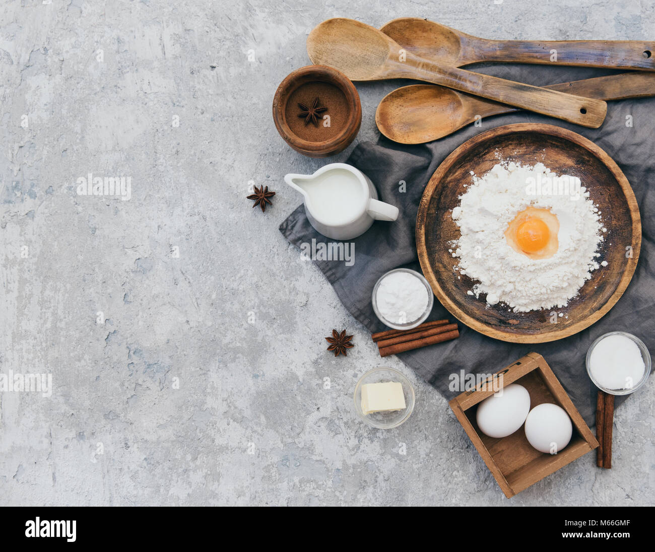 Baking ingredients and wooden utensils Stock Photo - Alamy
