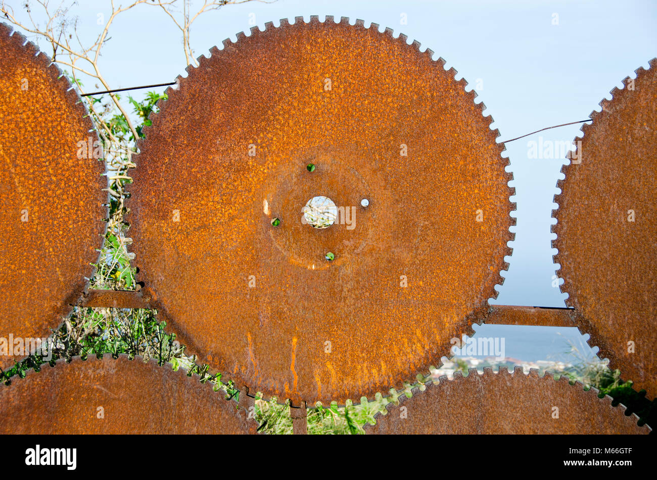 Fence gate made from old rusty circle blade tools Stock Photo - Alamy