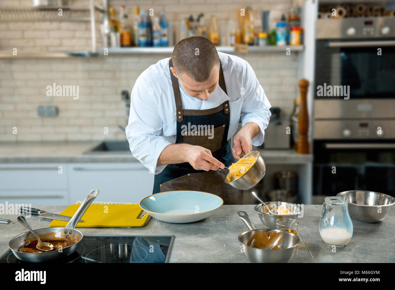 food cooking, profession and people concept - male chef cook serving ...