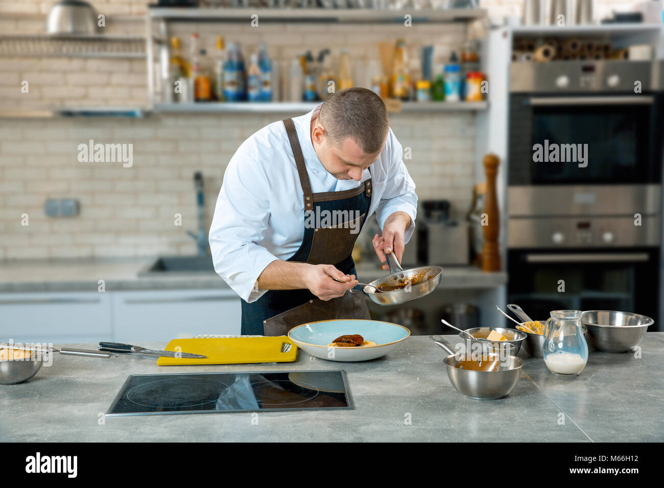food cooking, profession and people concept - male chef cook serving ...