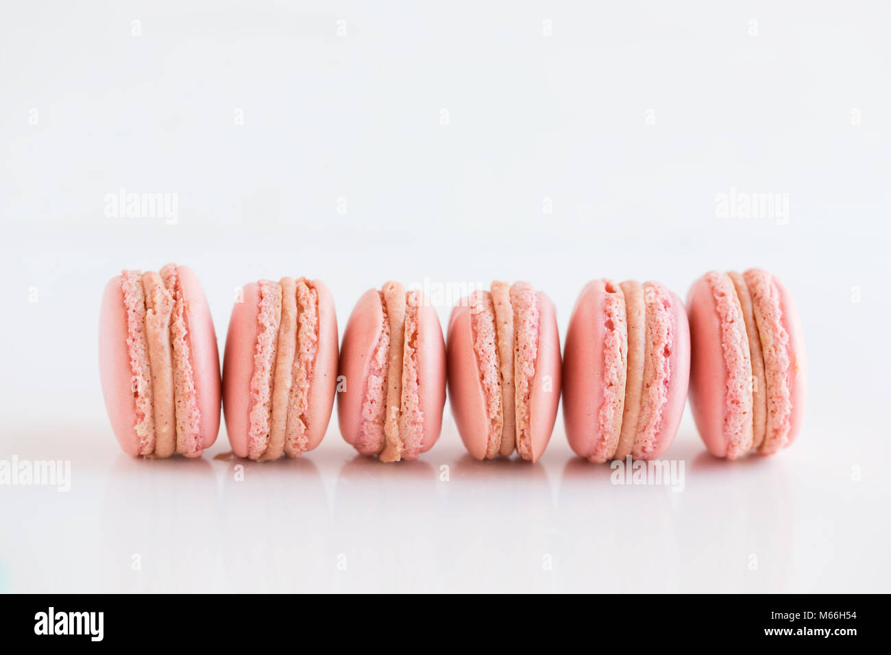 Row of strawberry macaroons Stock Photo - Alamy