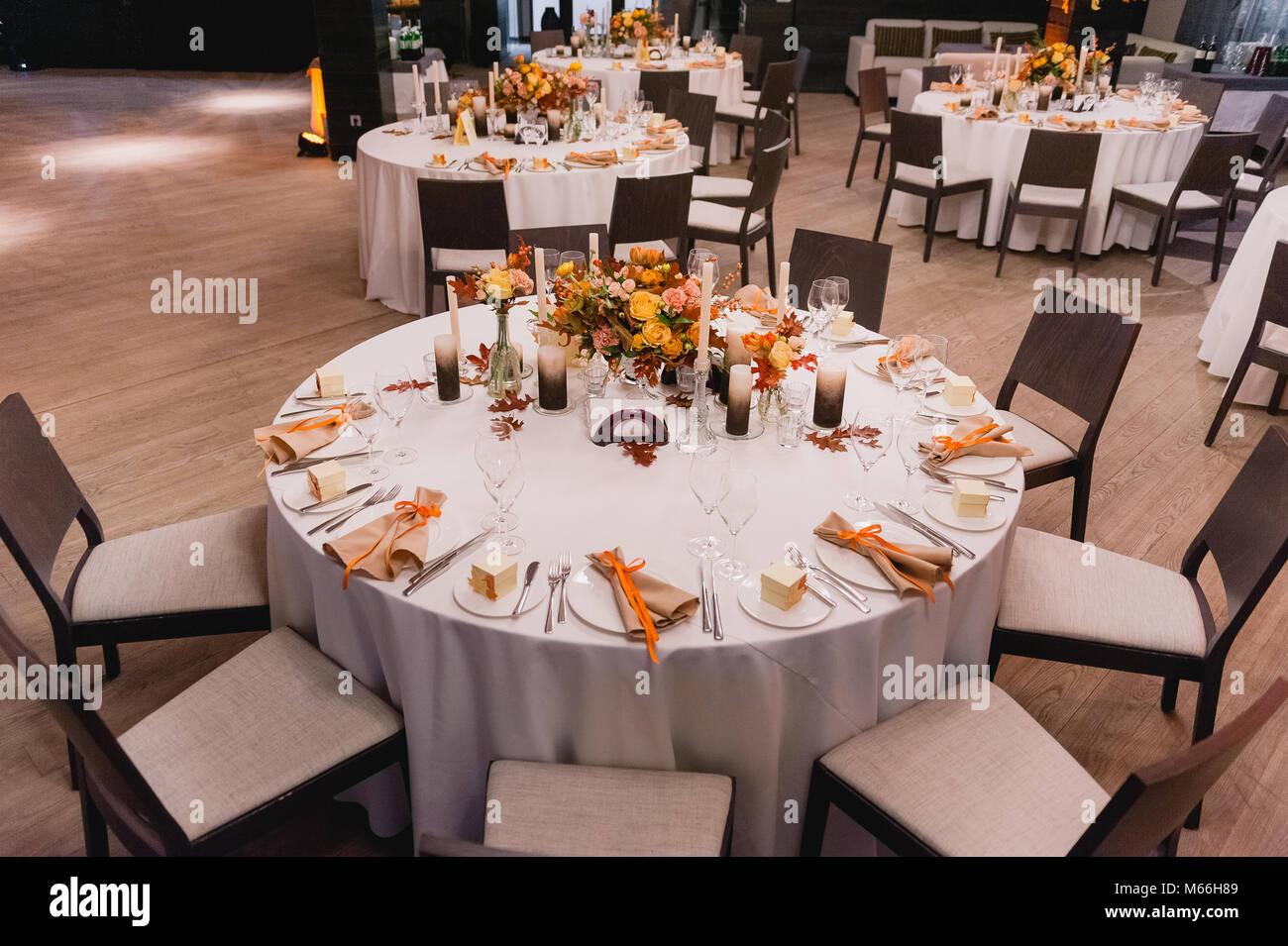 Banquet wedding table setting on evening reception awaiting guests ...