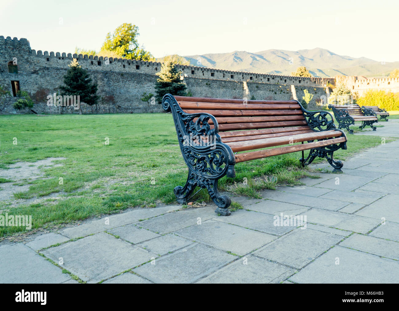 Stylish bench in summer park Stock Photo - Alamy