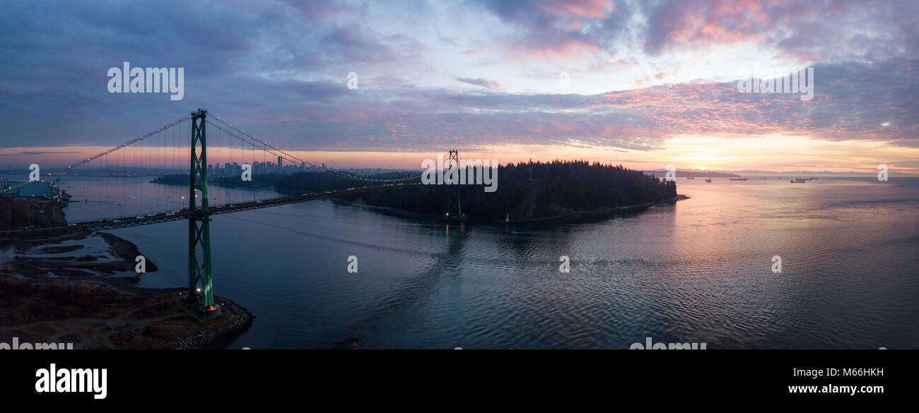 Aerial panoramic view of a famous landmark, Lions Gate Bridge, with ...