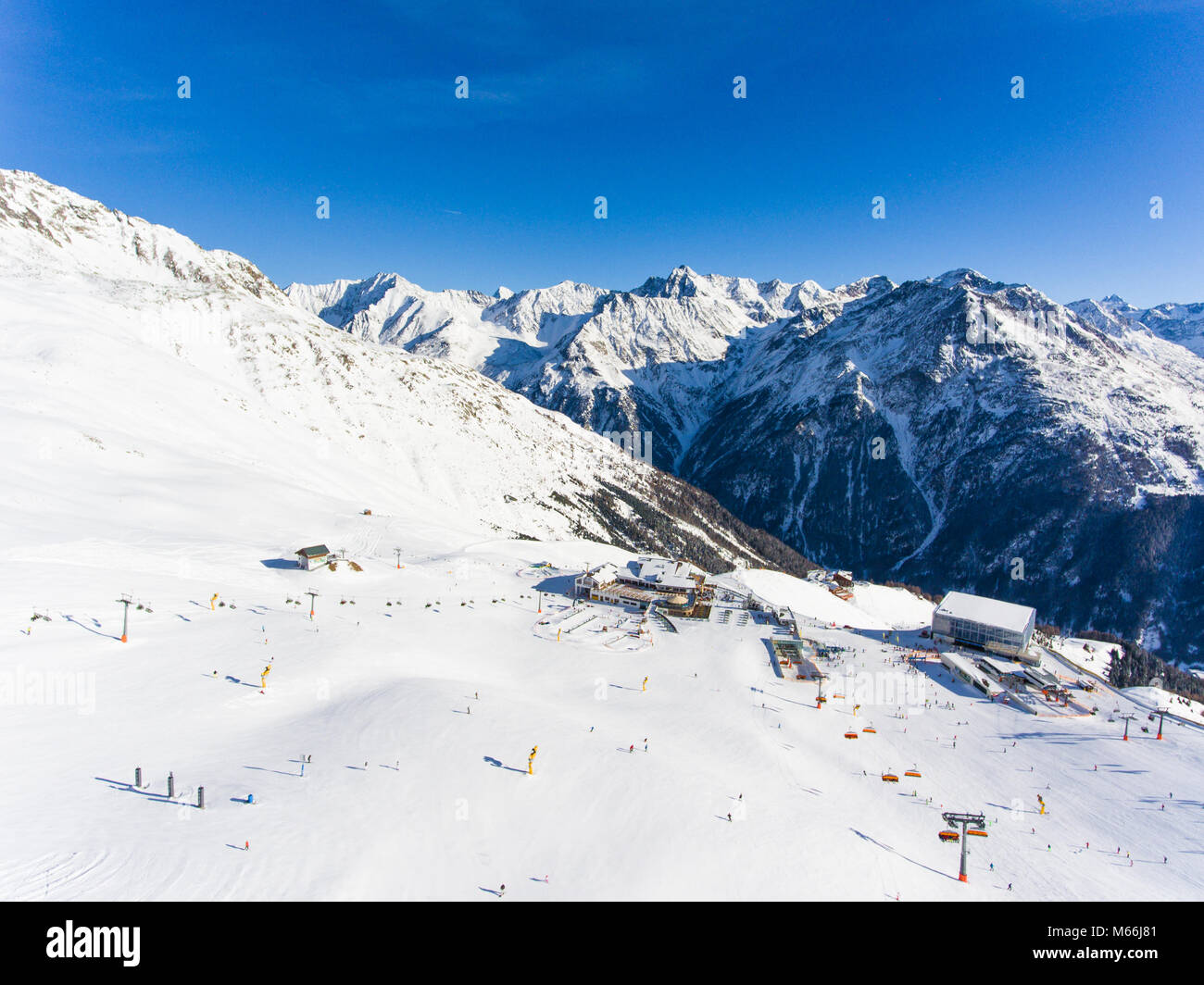Panoramic aerial view of ski resort in the Alps with ski lift and ...