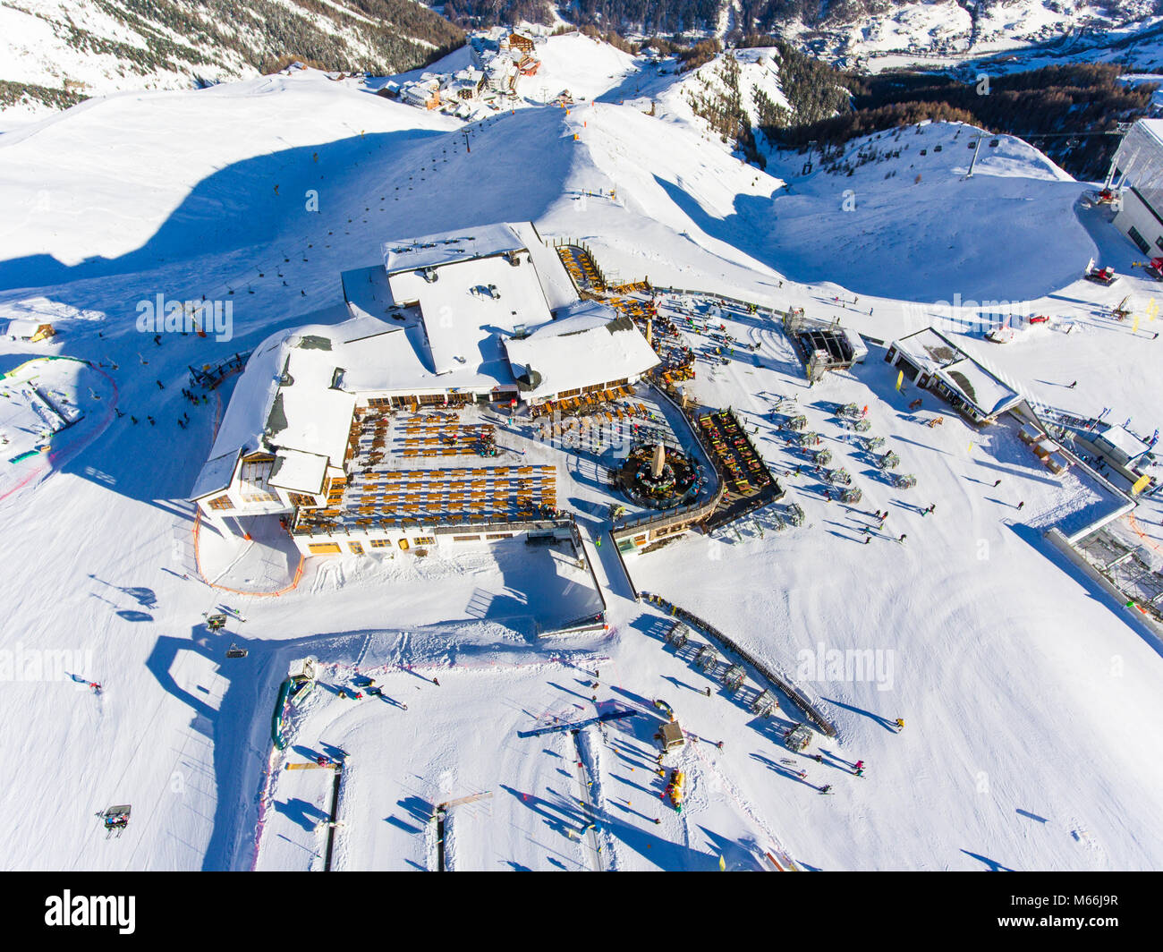Ski resort restaurant on top of the Alps, Aerial view Stock Photo - Alamy