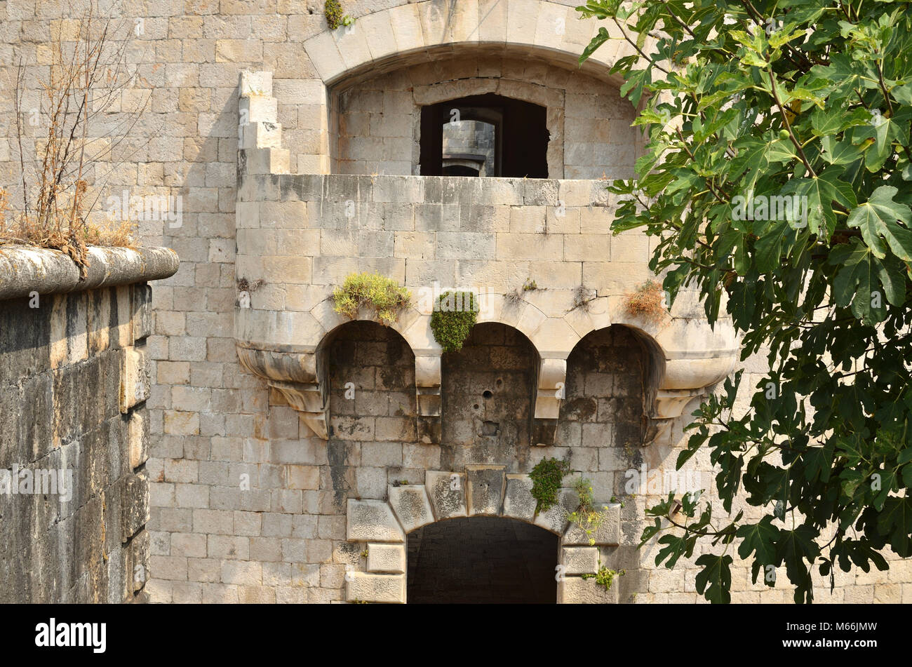 Front wall with a balcony of an old castle that used to be a prison ...