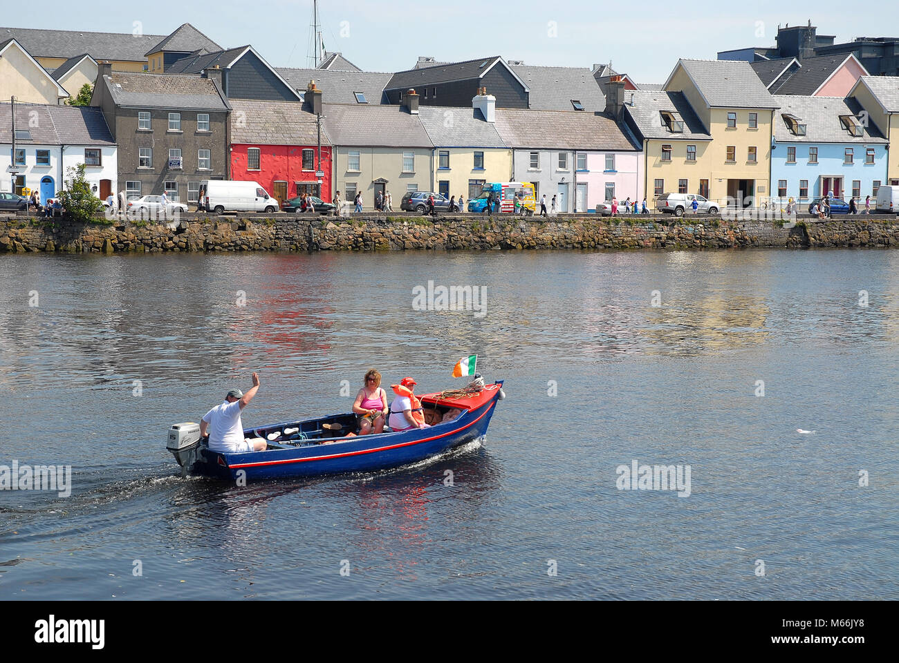 Family in a boat on the River Corrib in Galway harbour, Ireland Stock ...