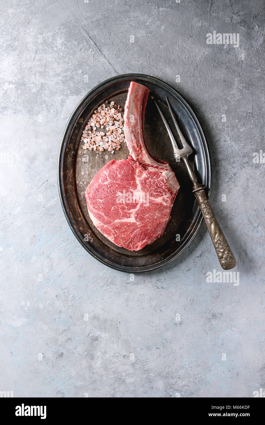 Raw tomahawk steak Stock Photo - Alamy