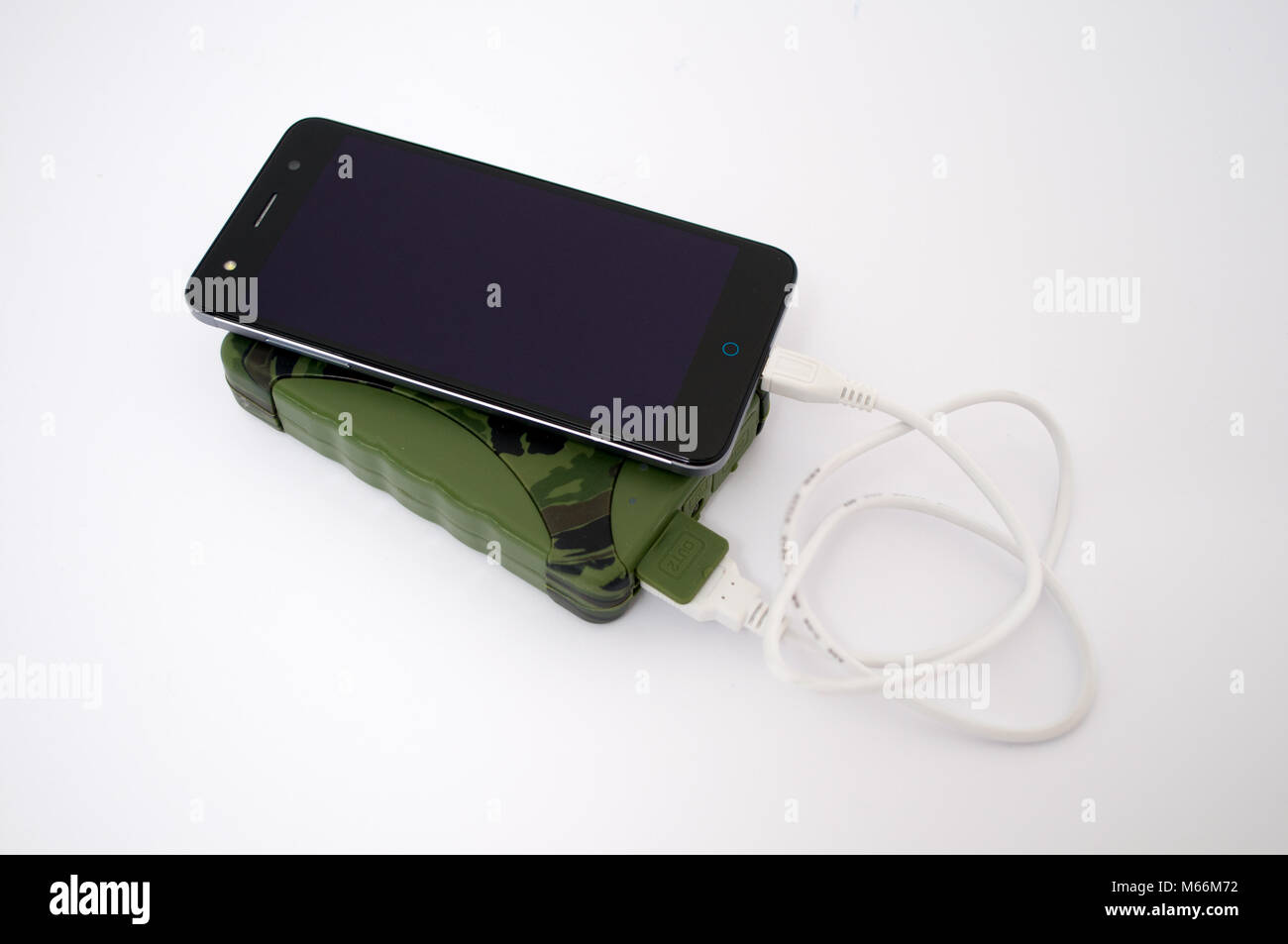Charge your phone with the help of the military power bank packs Stock ...