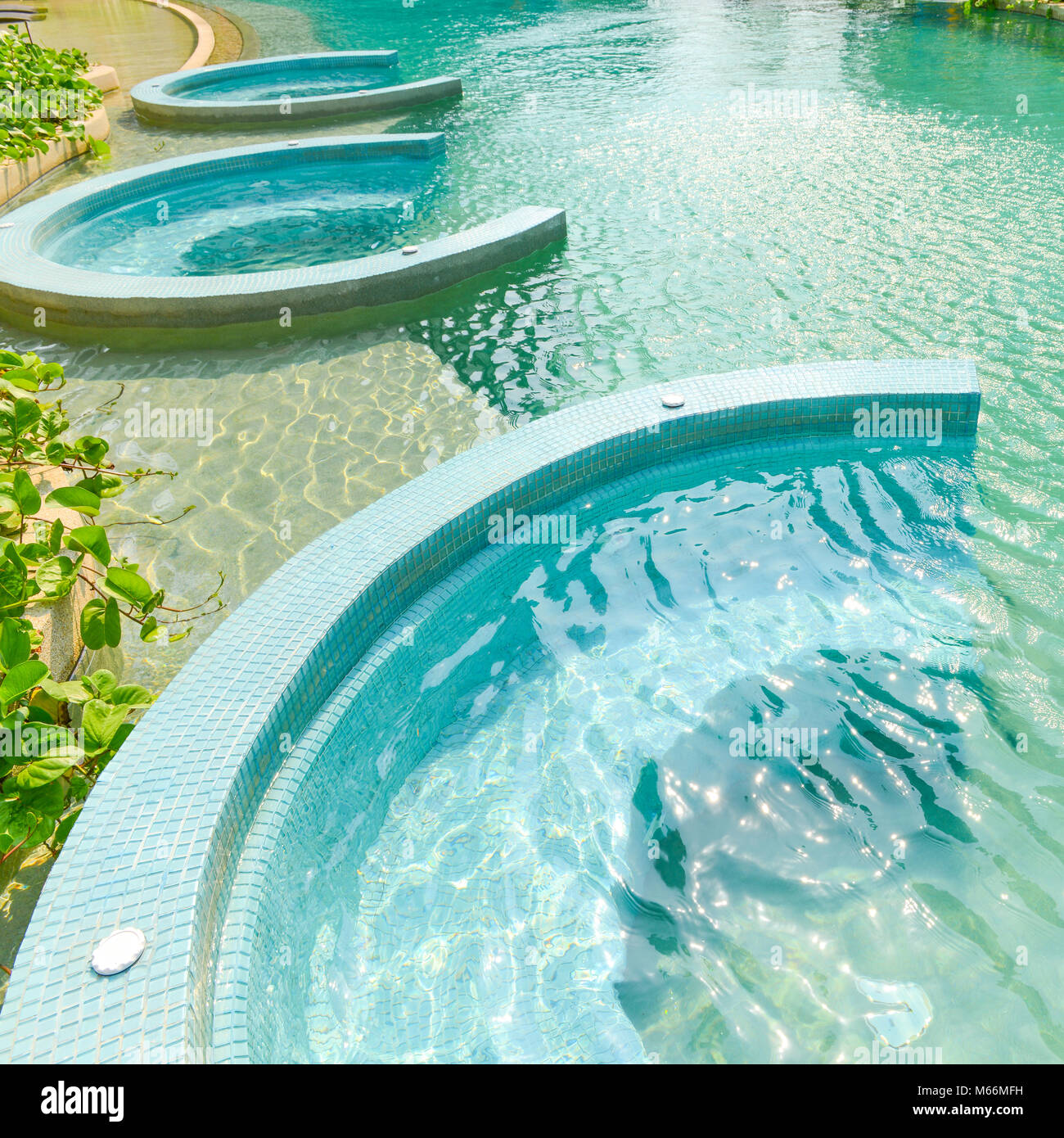 Jacuzzi outdoor blue swimming pool summer vacation Stock Photo - Alamy