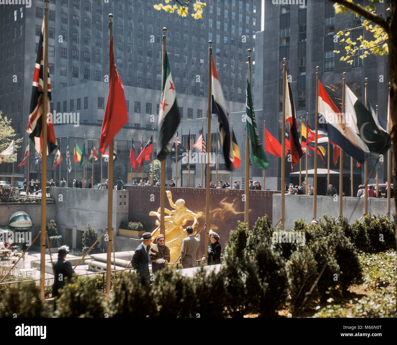 1950s SUNKEN PLAZA ROCKEFELLER CENTER PROMETHEUS FOUNTAIN AND FLAGS UNITED NATIONS SCULPTOR PAUL ...