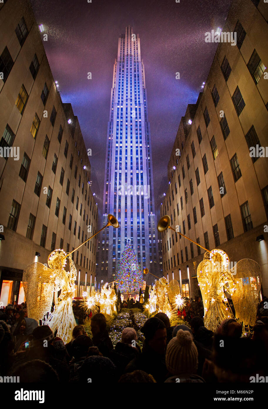 ROCKEFELLER CENTER AT NIGHT WITH LIT UP CHRISTMAS TREE AND ANGELS ...