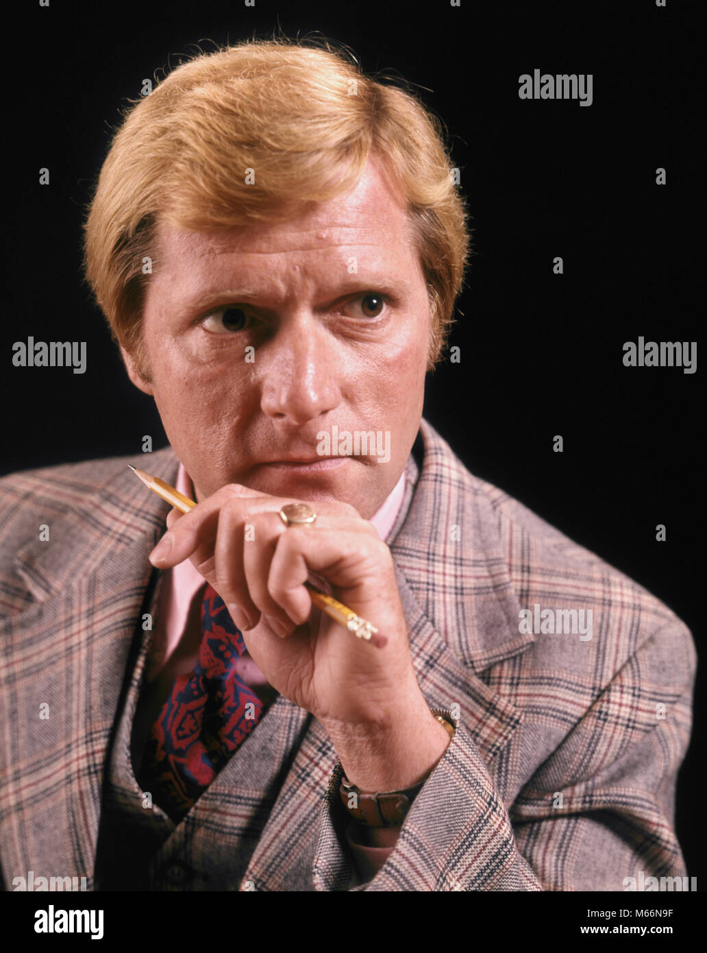 1970s BLOND BUSINESSMAN WITH AMBIGUOUS FACIAL EXPRESSION WEARING THREE ...
