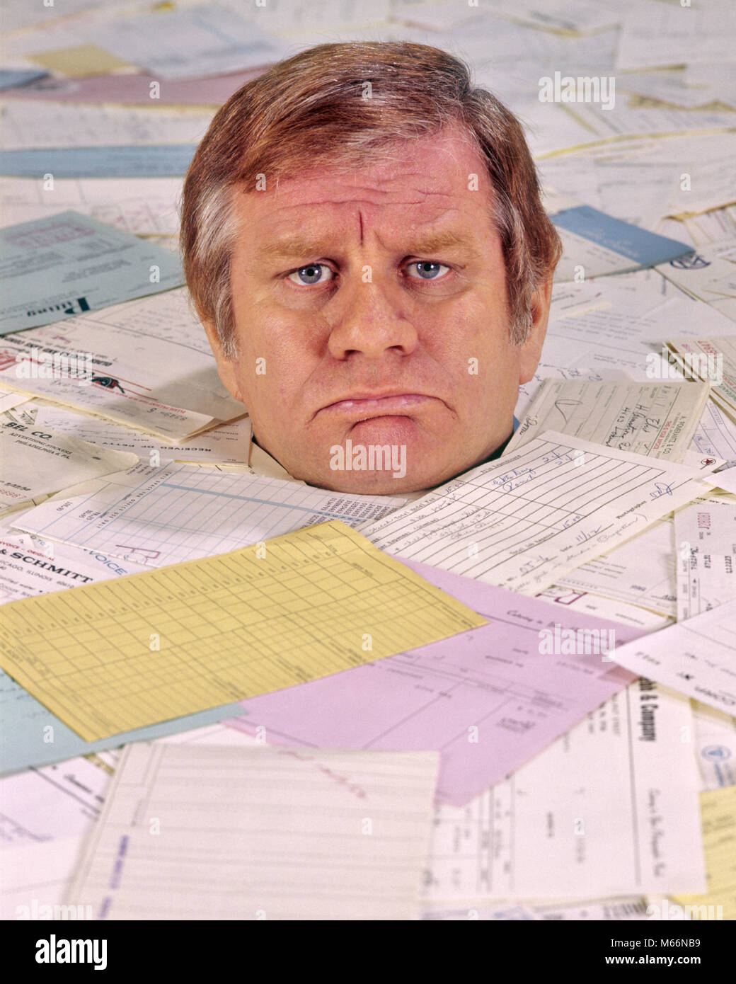 1970s 1980s ANGRY UNHAPPY FRUSTRATED MAN LOOKING AT CAMERA BURIED UP TO ...