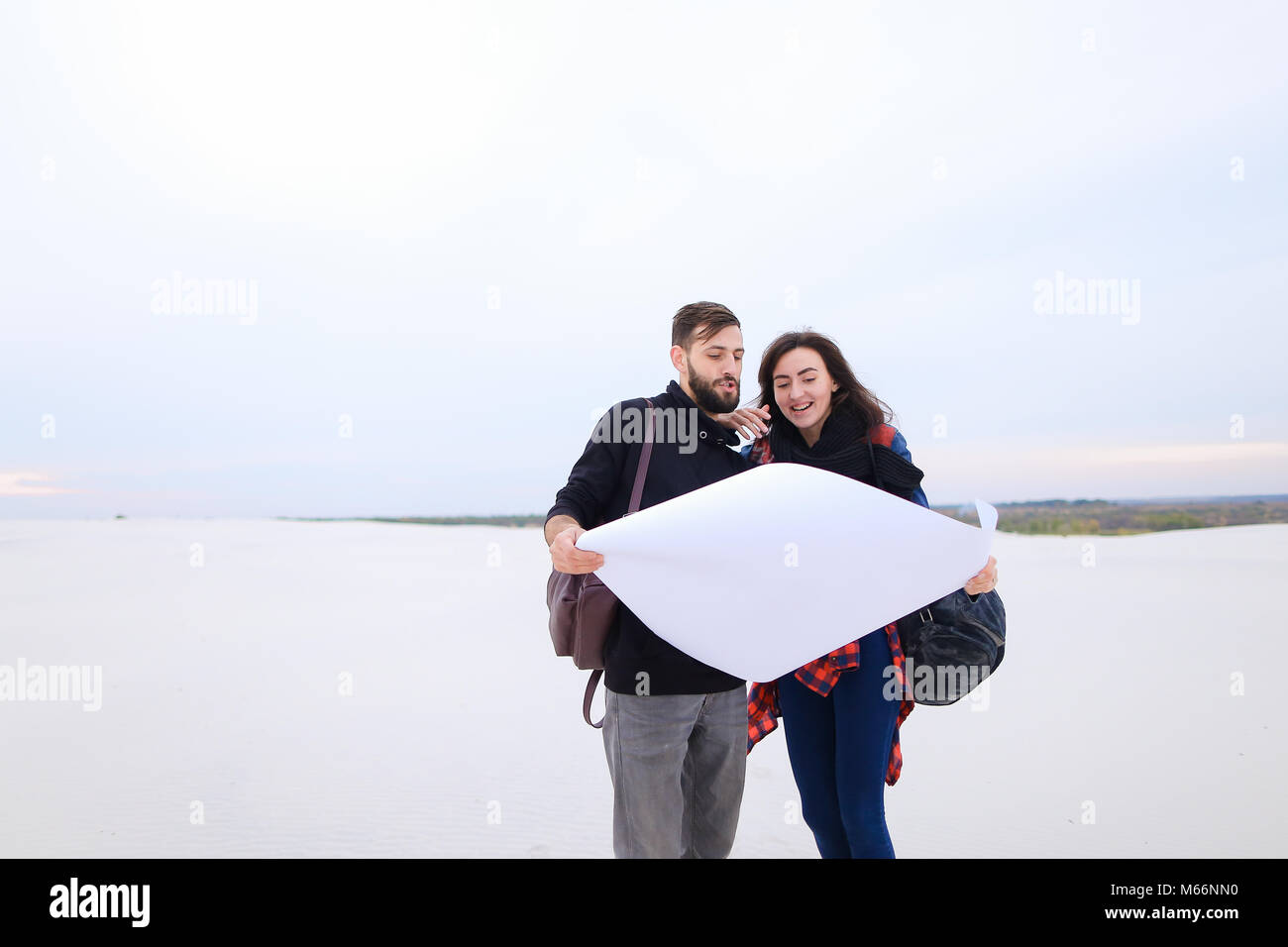 Presenters of travel program married couple viewing map Stock Photo - Alamy
