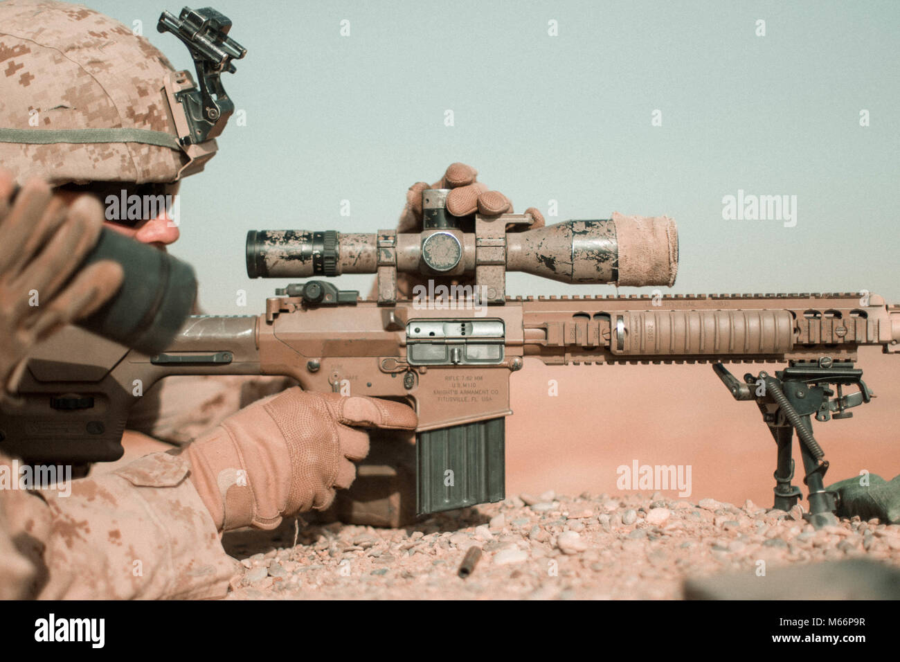 A U.S. Marine sniper with Task Force Southwest prepares to fire the ...