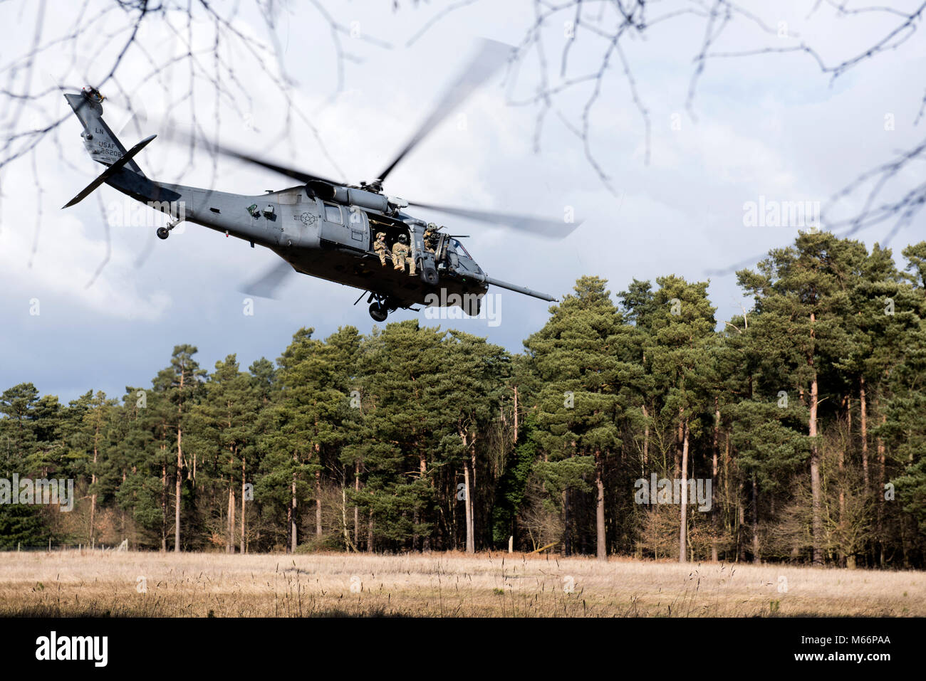 57th Rescue Squadron pararescueman depart in a 56th RQS HH-60G Pave ...