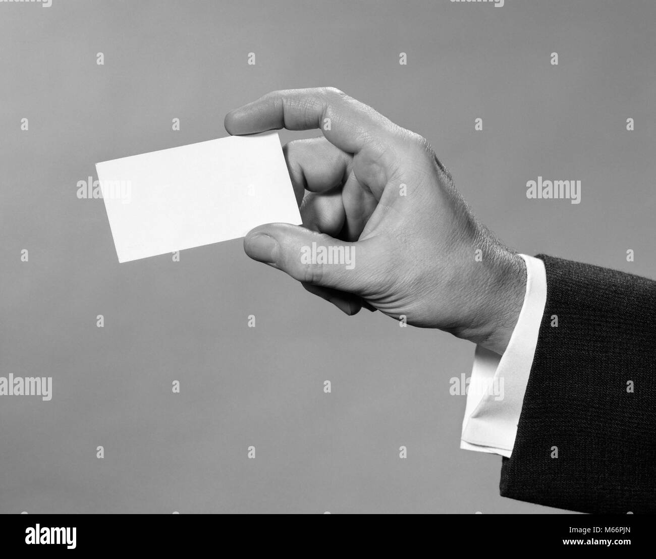 Man holding black card Black and White Stock Photos & Images - Alamy