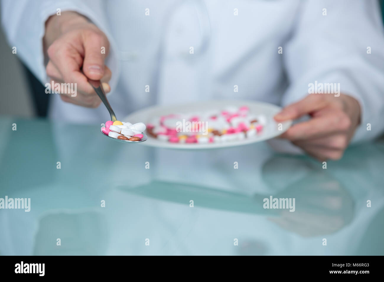 tablets in a spoon Stock Photo - Alamy