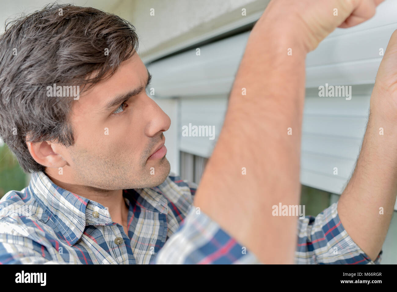 Fitting window shutters Stock Photo - Alamy