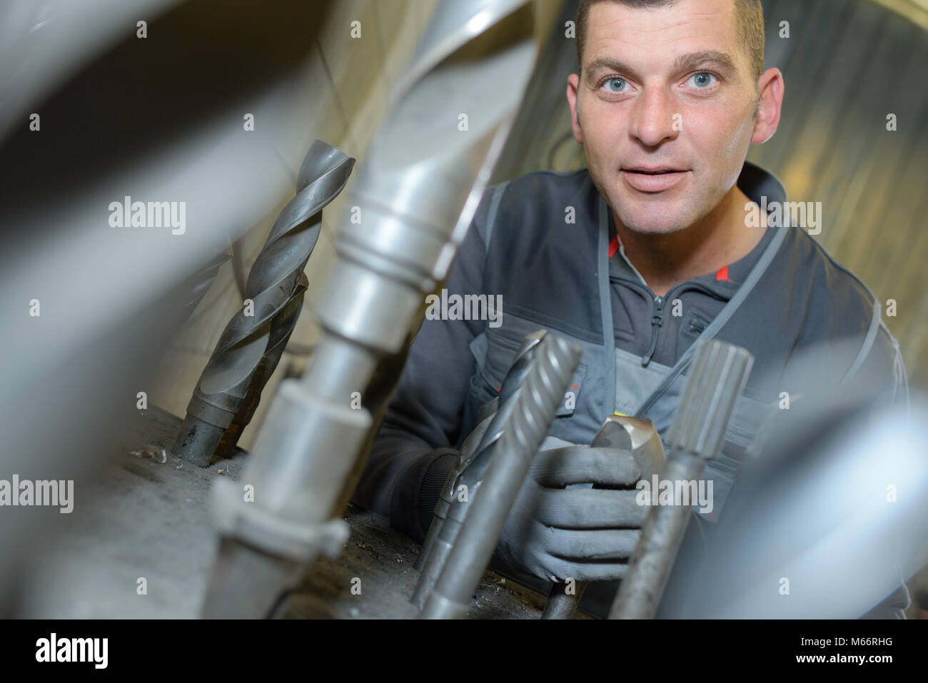 cheerful service man worker at factory Stock Photo - Alamy