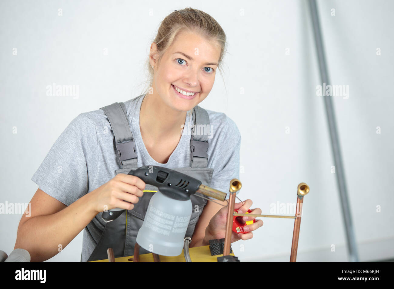 Lady using blow torch Stock Photo - Alamy